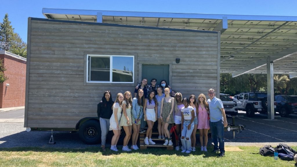 Carondelet High School Students with completed tiny house - Building Strong