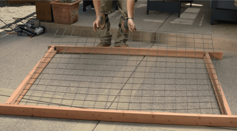 Lay the hog wire panel onto the attached 1x1 lumber - Building Strong